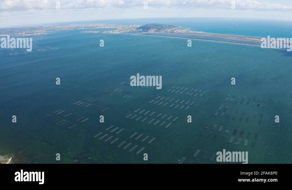 Large aerial view of Etang de Thau lagoon French mediterranean coast ...