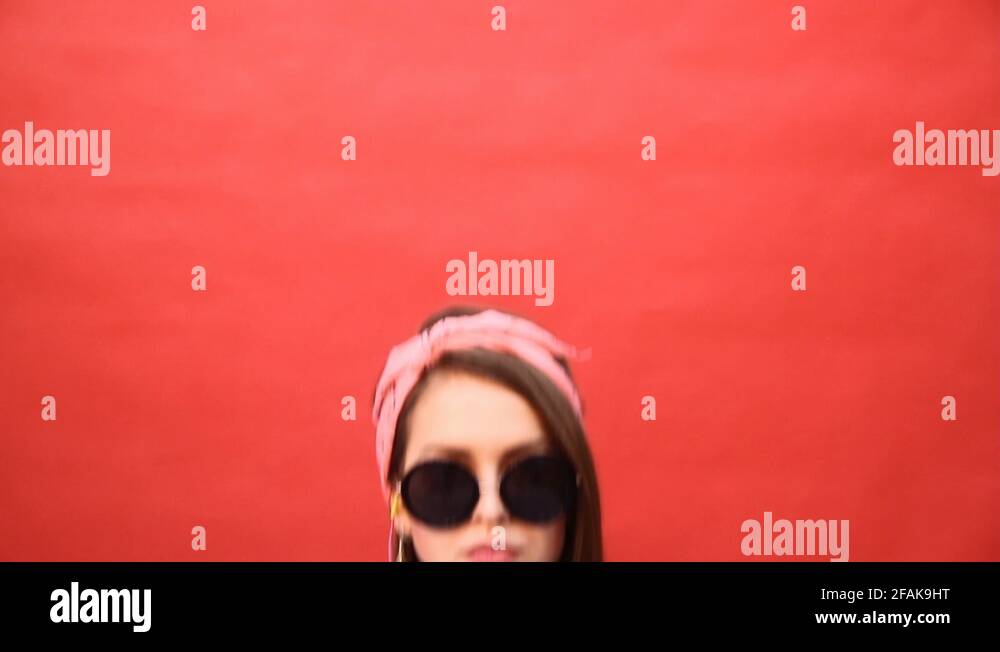 Girl Chews And Bursts The Cud On A Red Background Stock Video Footage Alamy