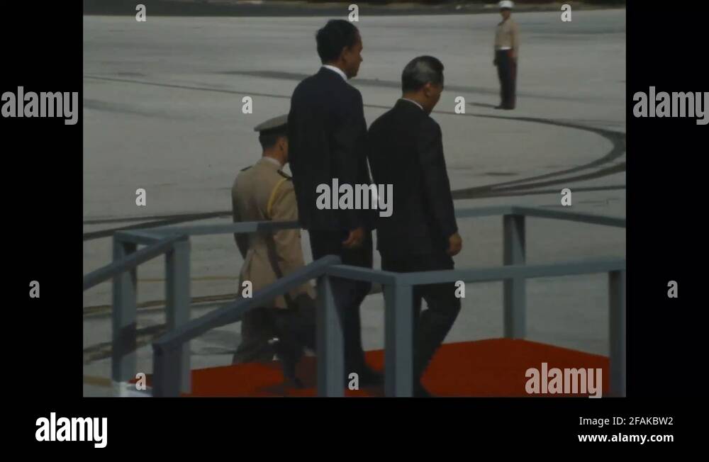 President Richard Nixon and Nguyen Thieu review U.S. band at airfield ...