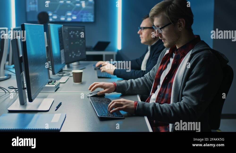Team of IT Programers Working on Desktop Computers in Data Center ...