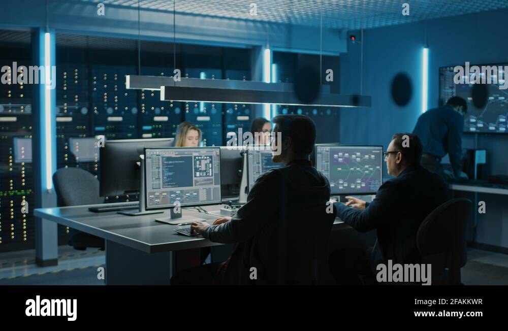 Team of IT Programers Working on Desktop Computers in Data Center ...