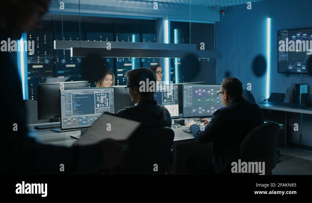 Team of IT Programers Working on Desktop Computers in Data Center ...