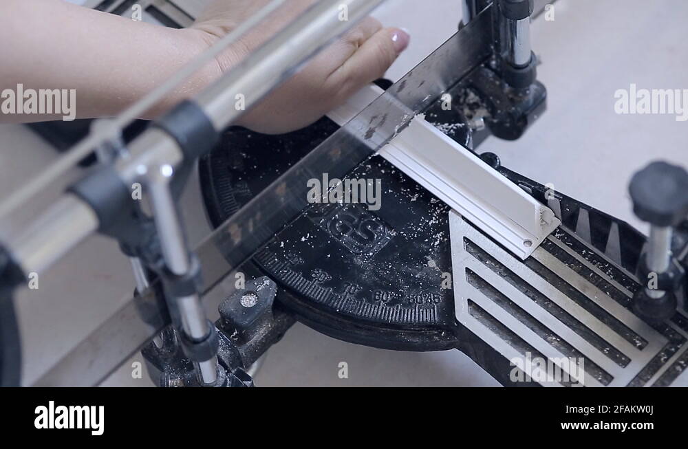sawing with a hacksaw skirting Board for ceiling Stock Video Footage ...