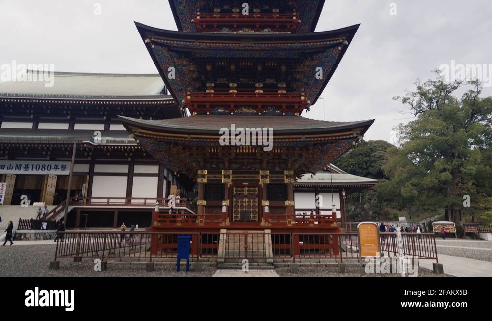 Cinematic Dolly In Forward Tilt Upwards under Roofs Shot of Three ...