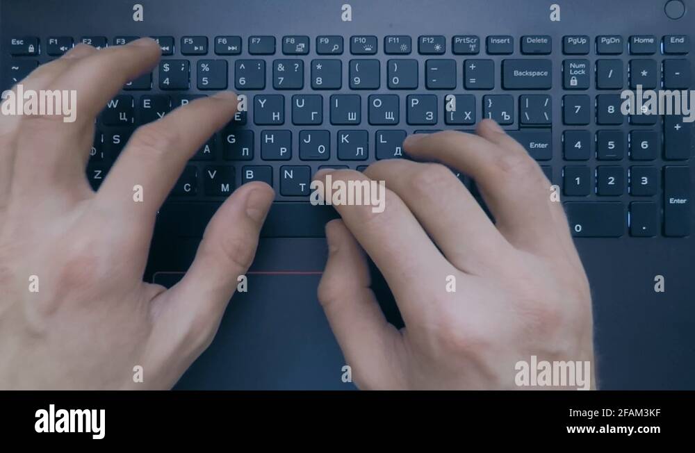 Two hands are typing on the keyboard of the laptop, top view, normal ...