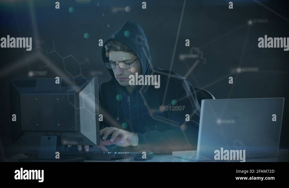 Hacker using computer in dark room Stock Video Footage - Alamy