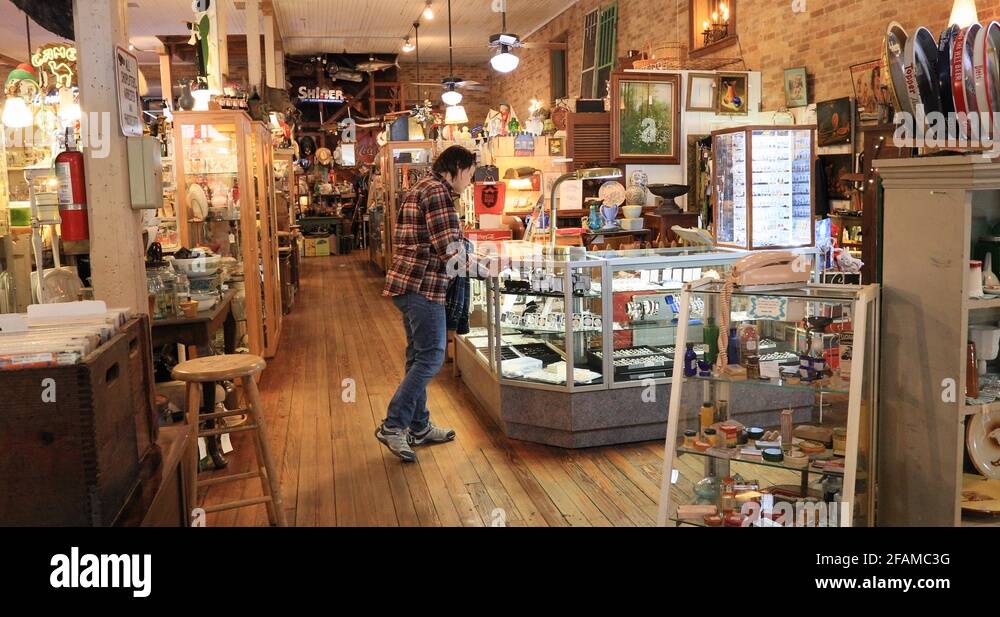 Shopping in old cluttered antique store Texas Woman 4K Stock Video ...