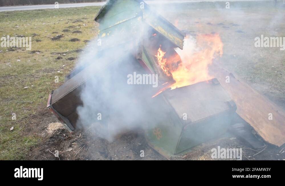 pile of dog houses on fire Stock Video Footage - Alamy