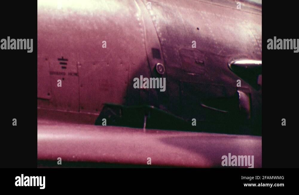 1970s: Gas tank cover pops up on airplane. Pilot in cockpit of plane ...