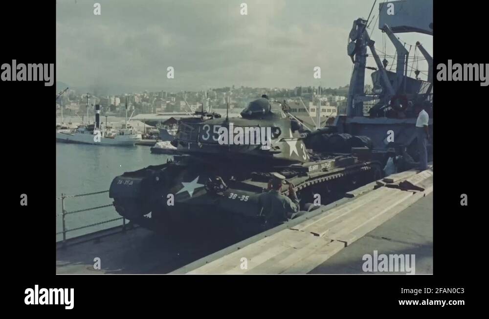 U.S. military soldiers load the tank on the ship deck - 1958 Stock ...