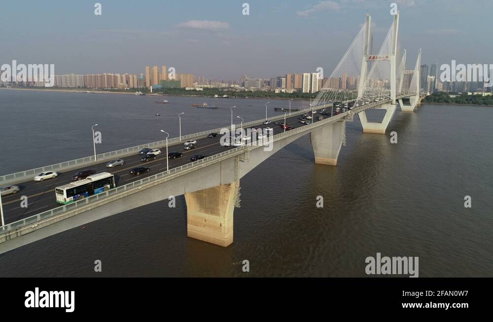 Drone flight along cable-stayed bridge over Yangtze river in Wuhan city ...