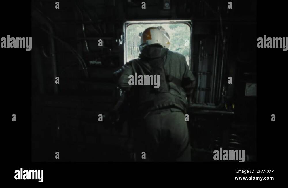 U.S. Marine Corps with gun embark into marine helicopter - 1982 Stock ...
