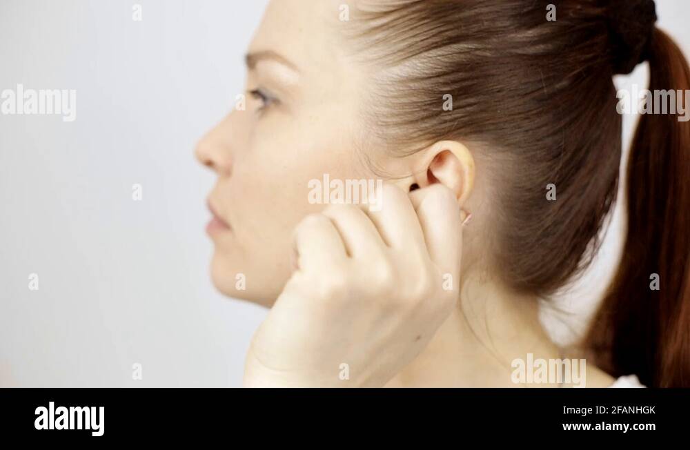 Woman touching ear Stock Videos & Footage - HD and 4K Video Clips - Alamy