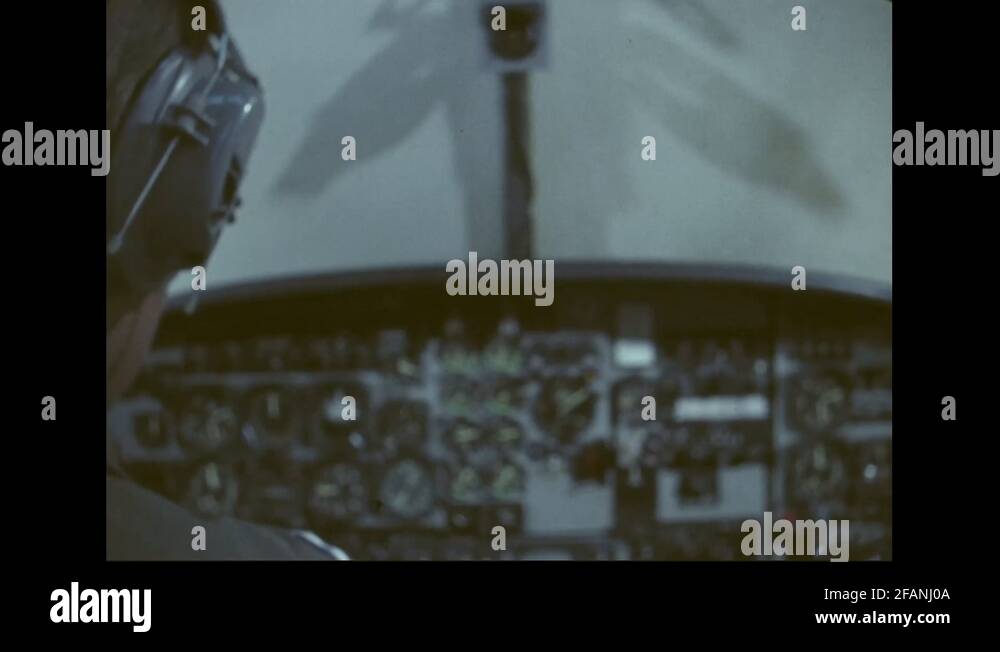 Women cadets operates controls in cockpit under guidance of instructor ...