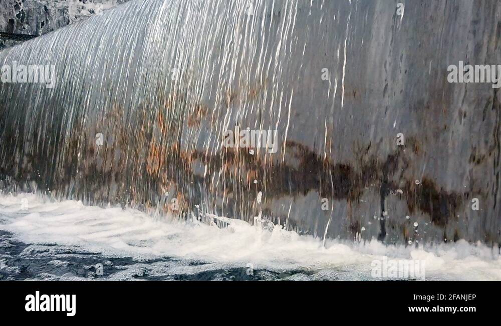 water flow falling down into water making foam in fountain Stock Video ...