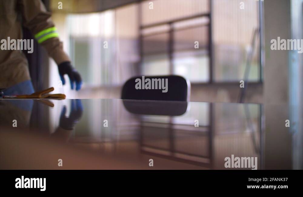 Video of a man breaking glass to be fitted to a window in PPE Stock ...