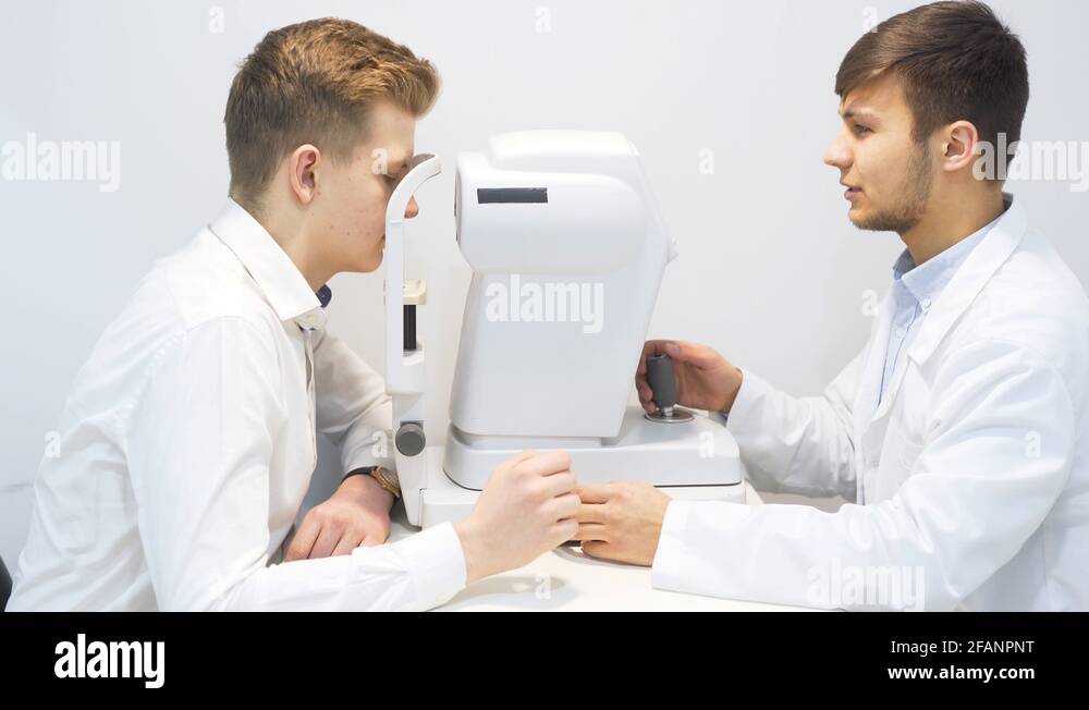Male Optician Examining Male Patient Eyes Using Equipment Stock Video ...