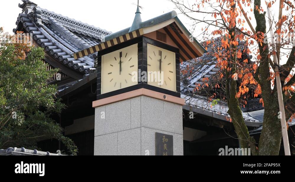 Old fashioned clock tower at Japanese shrine Stock Video Footage - Alamy