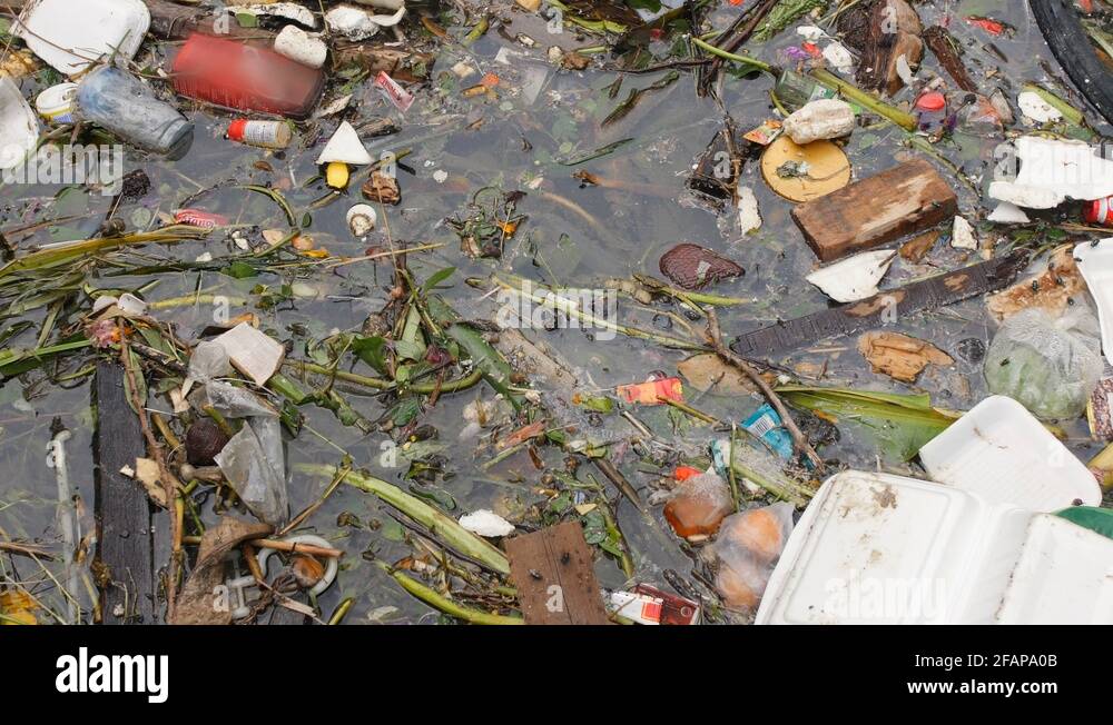 Plastic Waste Rubbish Floating in Lake Water. Huge Dump in Tropical ...