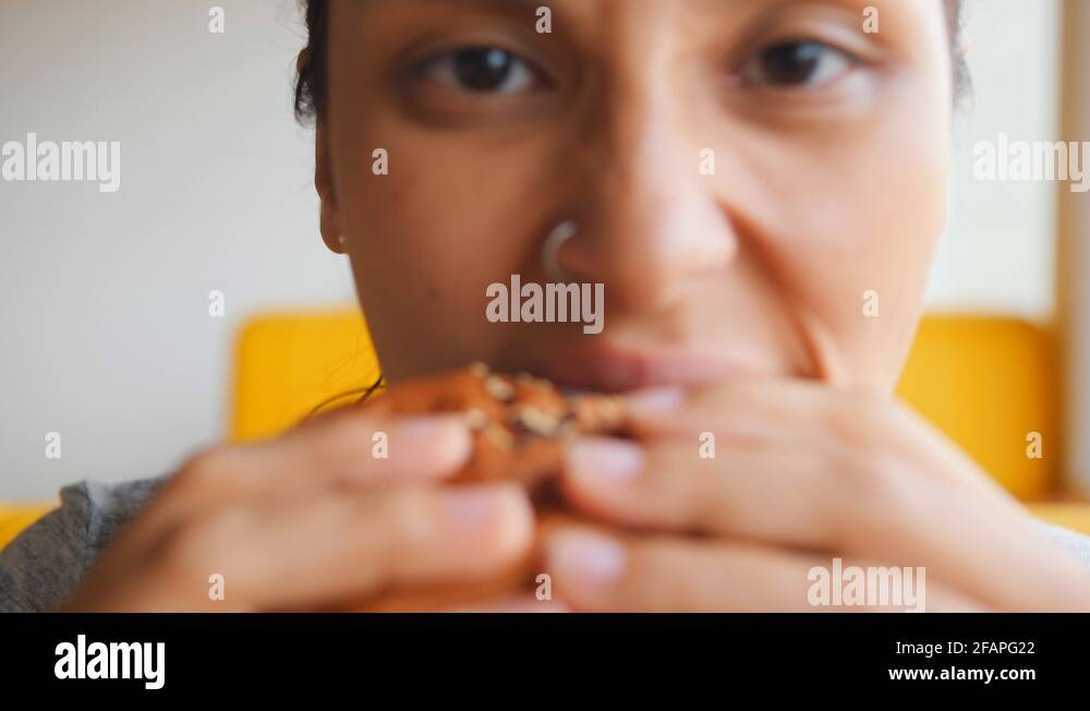 Portrait of Young Angry Woman Eating Vegan Burger in Fast Food ...