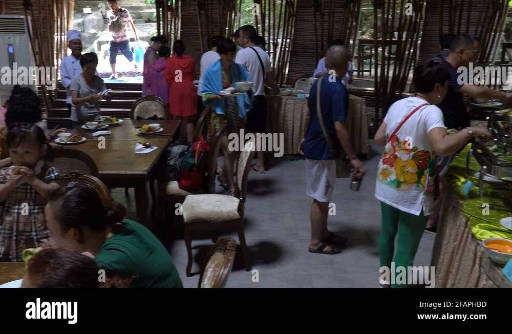 Luxury resort on a tropical island. A crowded restaurant buffet. Travel ...