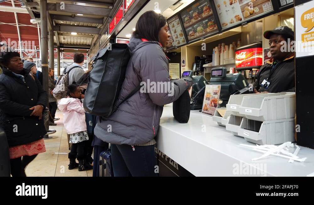 Customers ordering fast food at a Burger King restaurant in London, UK ...