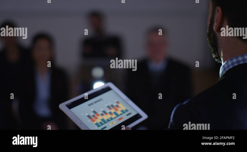 4K Businessman using animated sales graph to give a presentation to ...