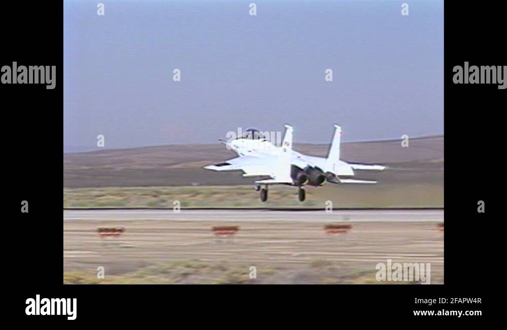 1990s: F-15 aircraft departs. Flight path stabilizer over landing strip ...