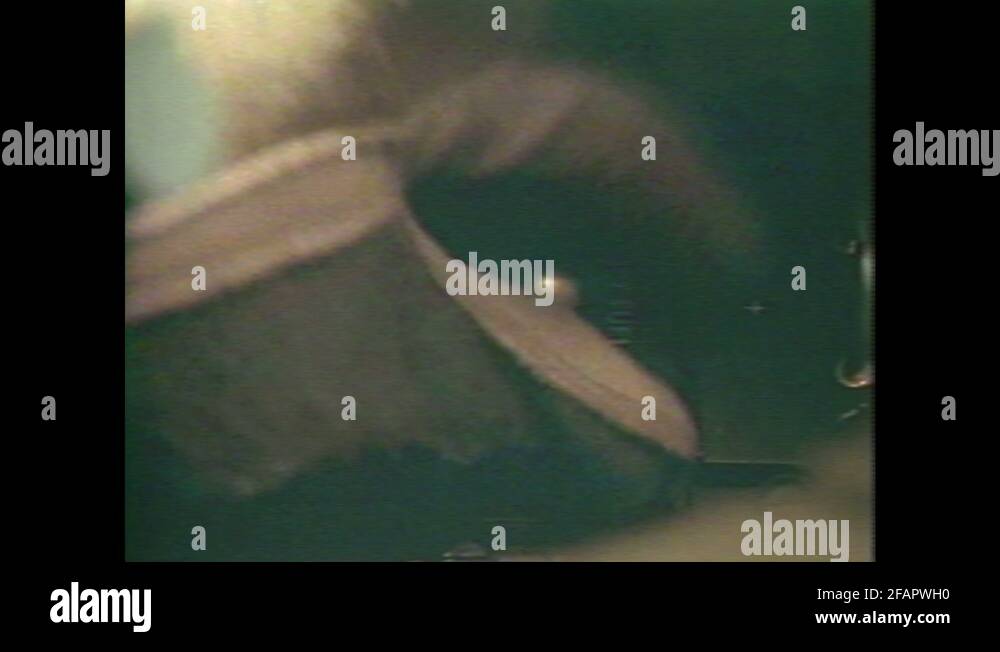 1990s: Hand flips switch. Flaps on fighter jet open. Jet taxies on ...