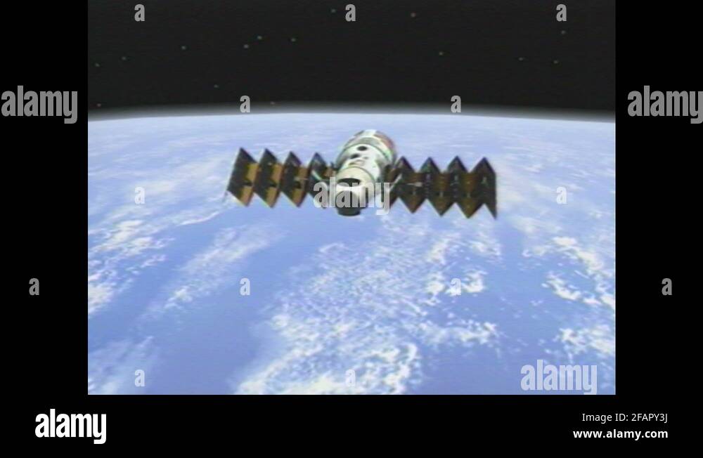 1990s: Space station expands solar array. Space station component docks ...