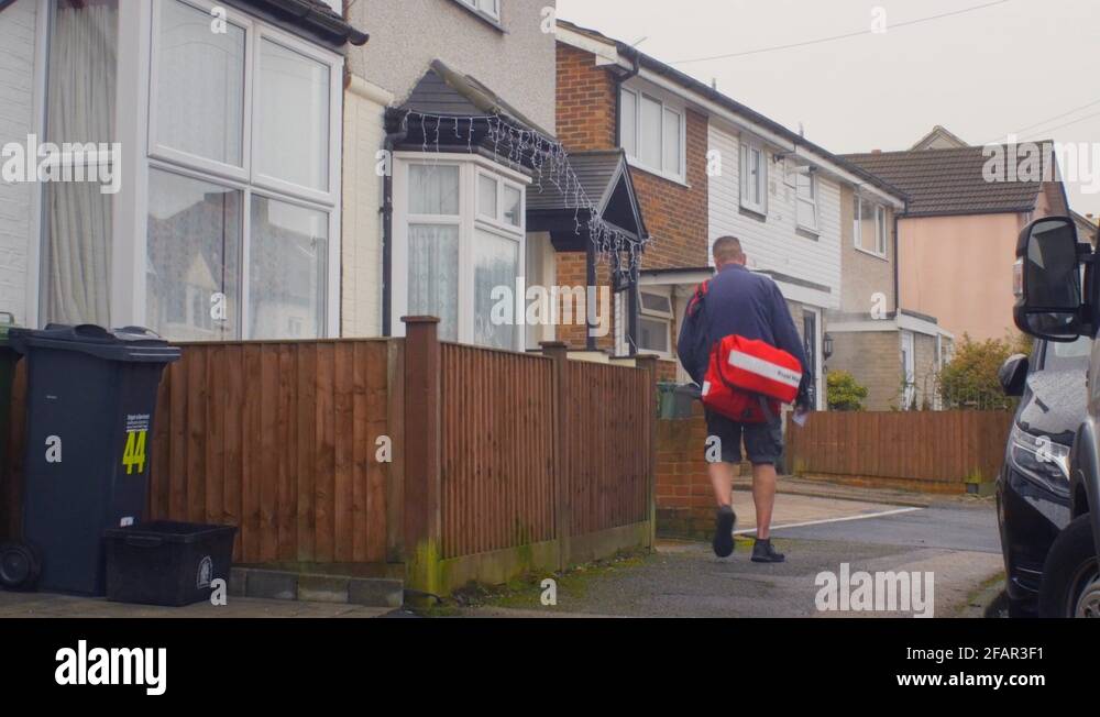 Uk postman at door Stock Videos & Footage - HD and 4K Video Clips - Alamy