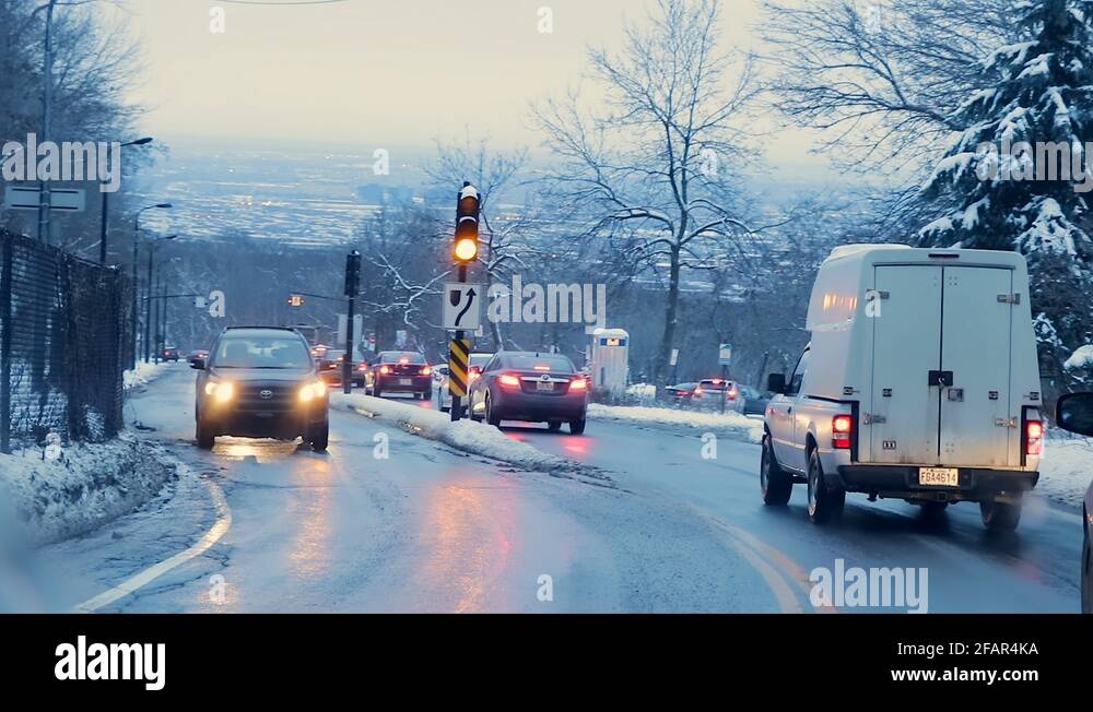 A car coming on the oposit direction on a two way road with heavy ...