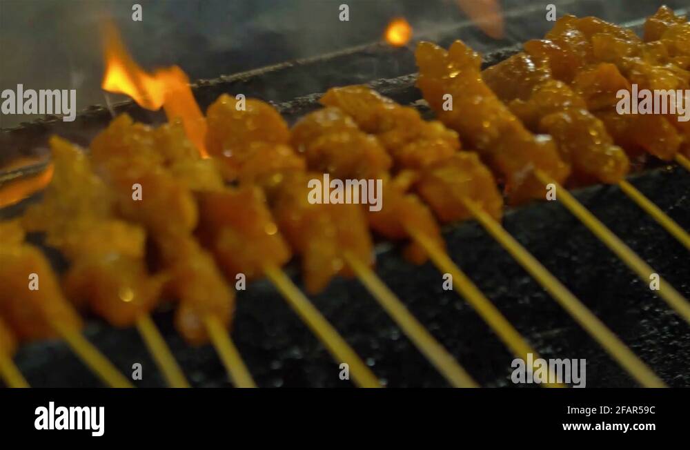 Chicken cooked food satay sticks thai Stock Videos & Footage - HD and ...