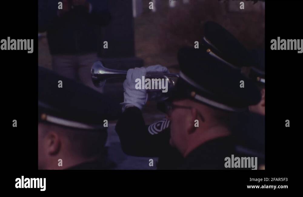 Bugler play bugle in the gravesite during Edward White funeral ceremony ...