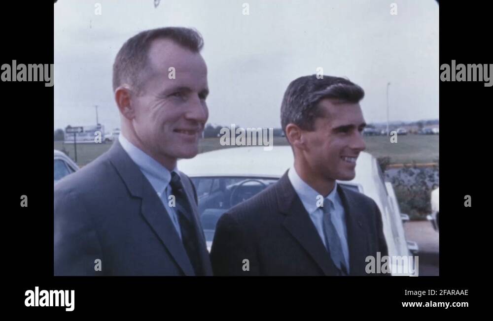 Astronauts talking to each other outside the building - 1966 Stock ...
