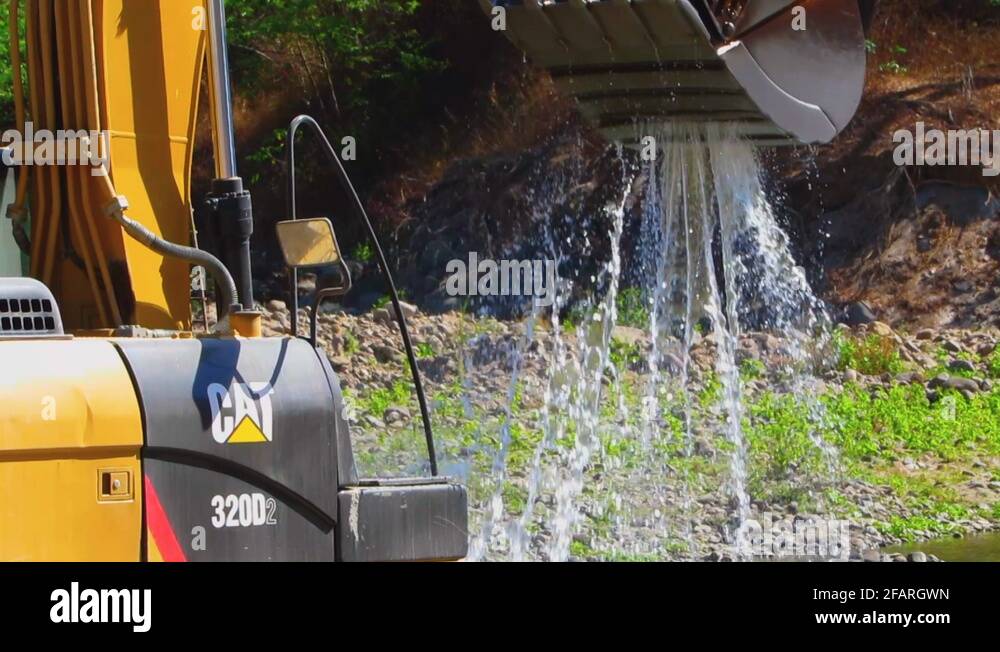 Using backhoe Stock Videos & Footage - HD and 4K Video Clips - Alamy