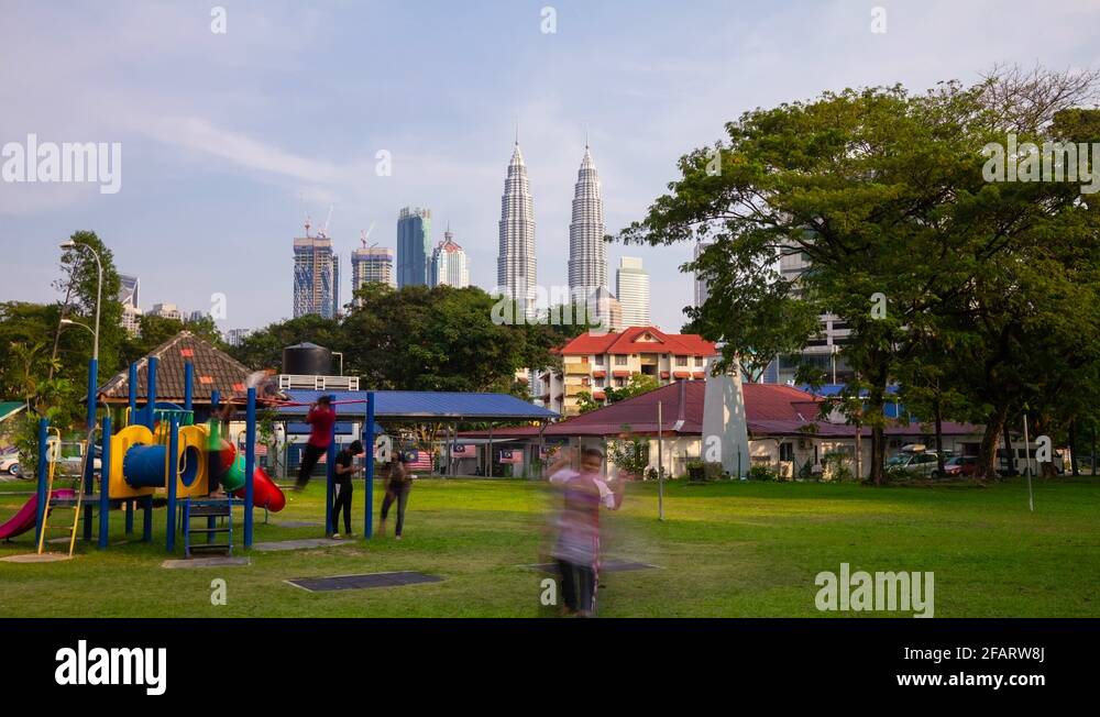 kuala lumpur downtown towers crowded playground 4k timelapse malaysia ...
