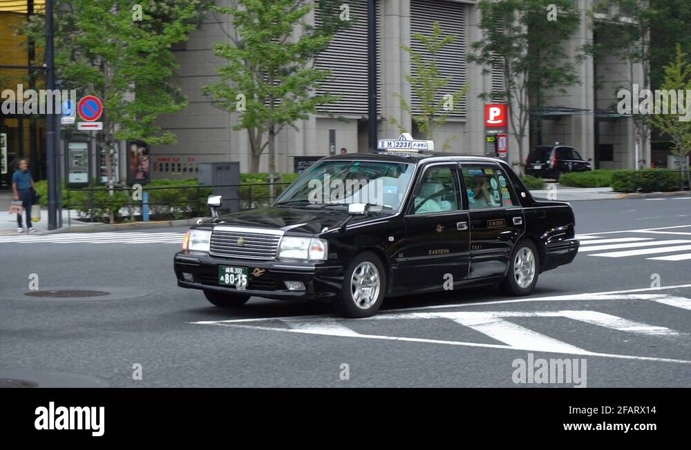 Iconic Taxi Cab Driving By in Tokyo, Japan Stock Video Footage - Alamy