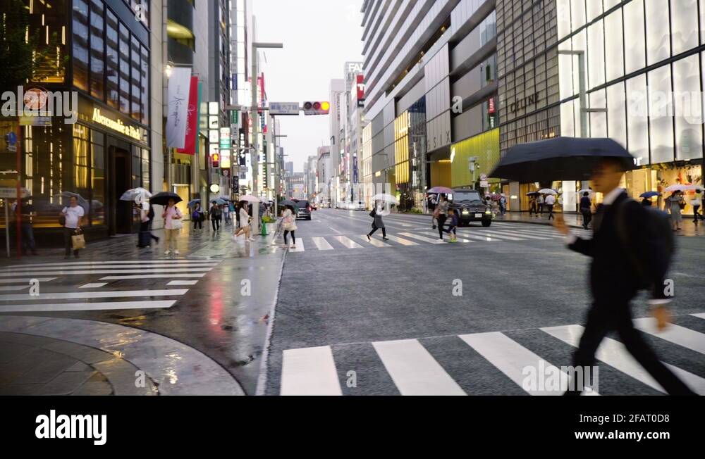 Side View - Crossing Street in Tokyo Stock Video Footage - Alamy