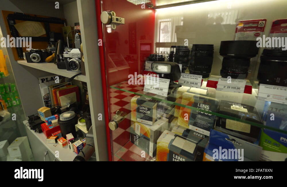 Showcase display with new and vintage cameras in camera store Stock ...