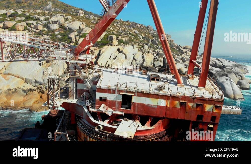 Shipwreck in the ocean with rock and mountain background Stock Video ...