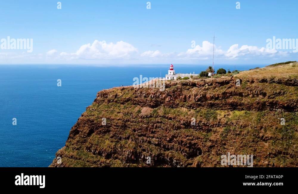 AERIAL LANDSCAPE FOOTAGE OF PONTA DO PARGO LIGHTHOUSE IN MADEIRA ISLAND ...