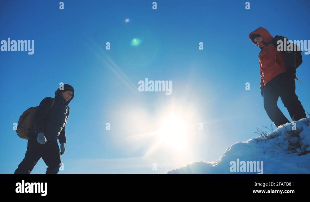 teamwork tourists winter snow business travel trip lends a helping hand ...