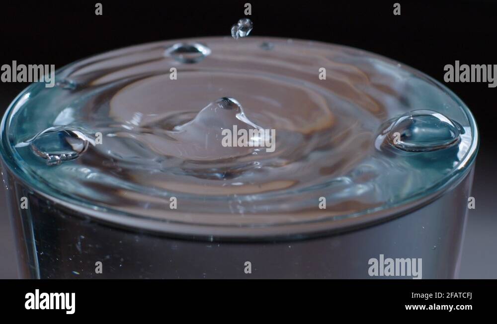 water is dripping into a glass Stock Video Footage - Alamy