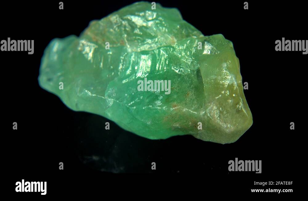 Seamlessly rotating a lime mineral (Green Calcite) in front of black ...