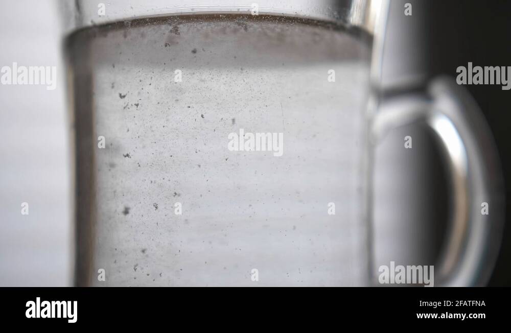 Aspirin Effervescent Tablet Falling Into Glass and Dissolving in Water ...