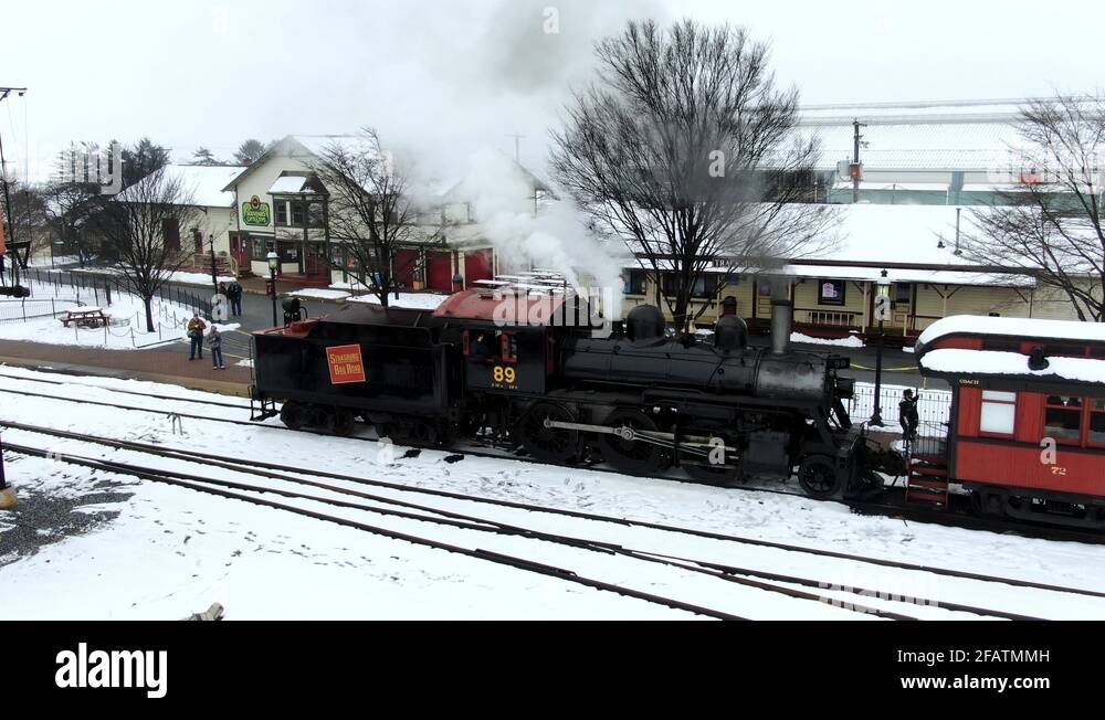 Aerial conductor on a restored steam-powered train hand signals ...
