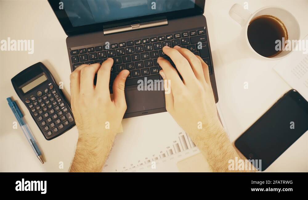 Typing on laptop computer top view Stock Video Footage - Alamy