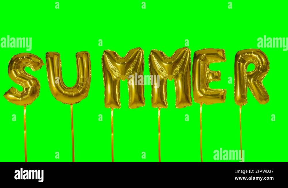 Word summer from helium golden balloon letters floating on green screen ...