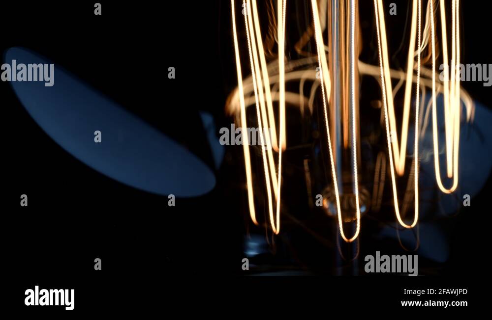Flickering And Vibrating WIring Of Blinking Newton Lightbulb Stock ...